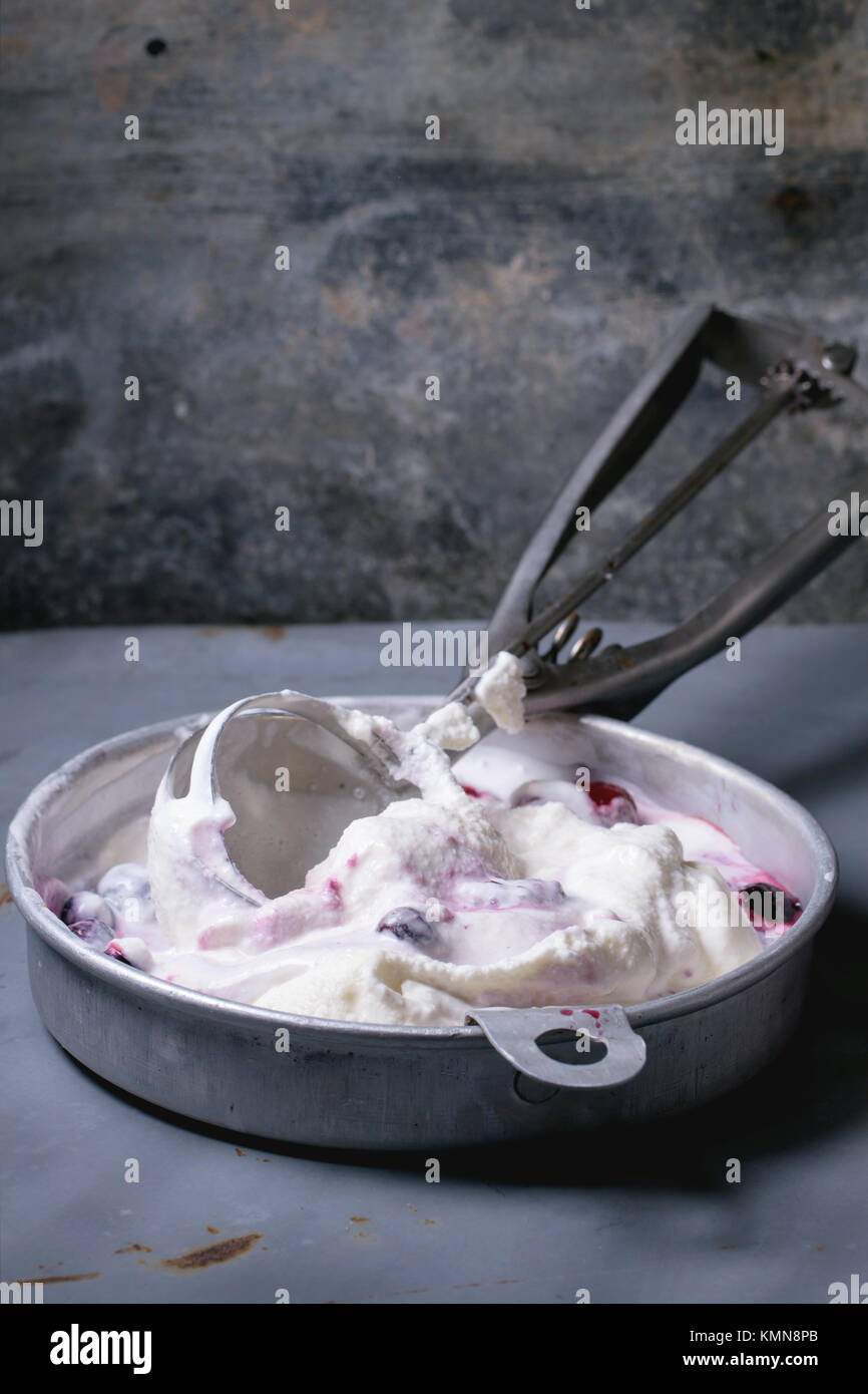 Aluminium plate with homemade vanilla ice cream and mix of frozen ...