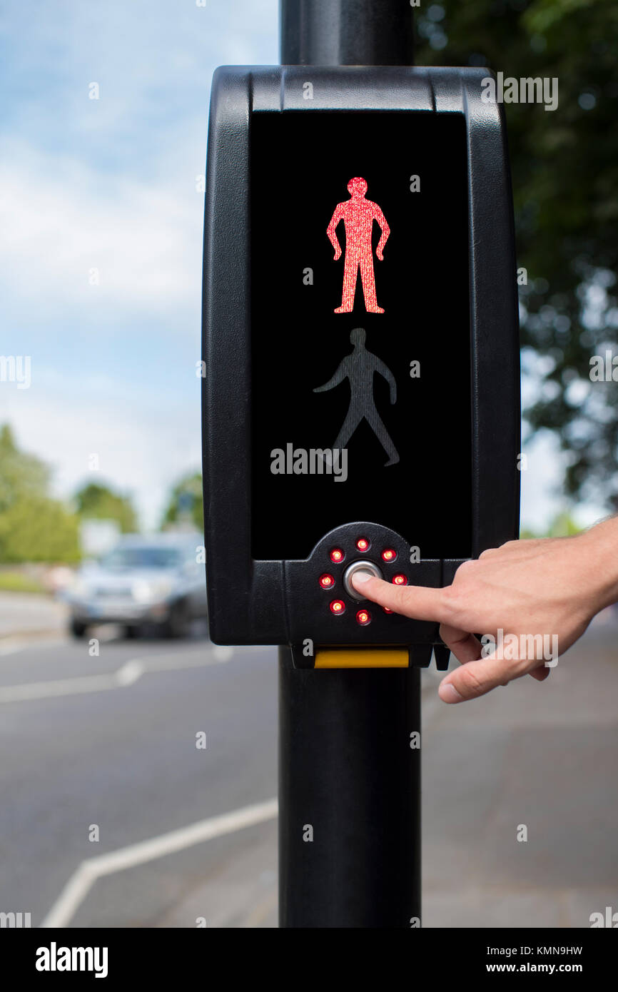 Hand Pressing Button On Pedestrian Crossing Stock Photo - Alamy