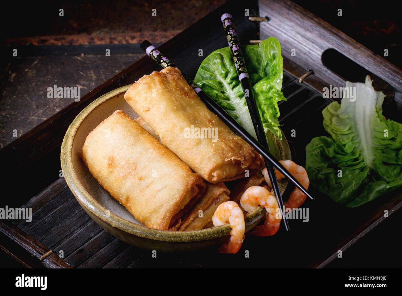 Fried spring rolls with vegetables and shrimps, served in ceramic bowl ...