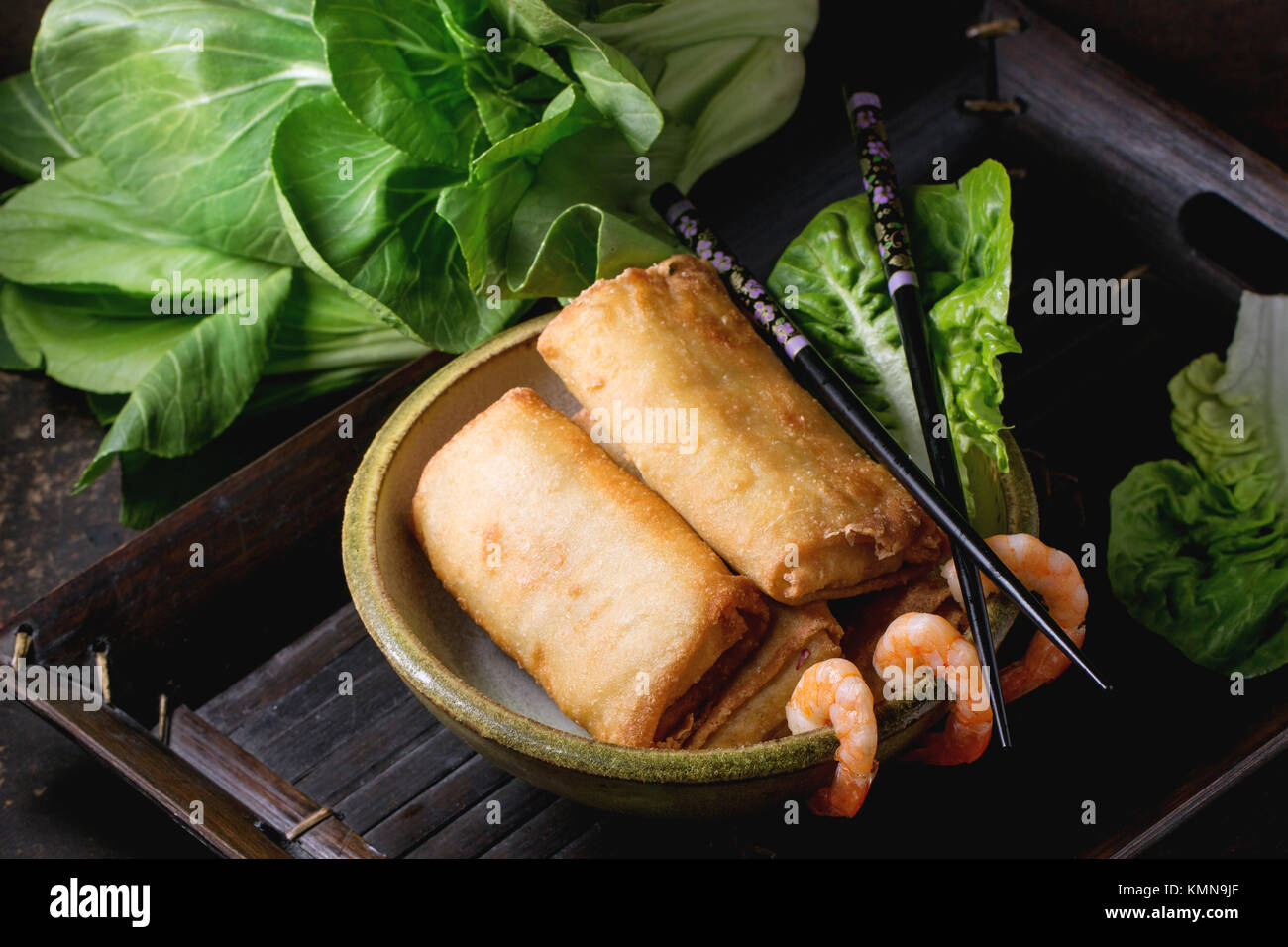 Fried spring rolls with vegetables and shrimps, served in ceramic bowl ...