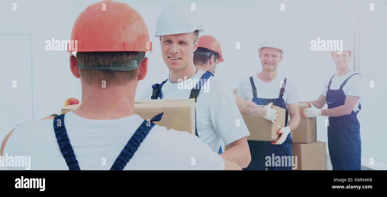 workers unload boxes Stock Photo - Alamy