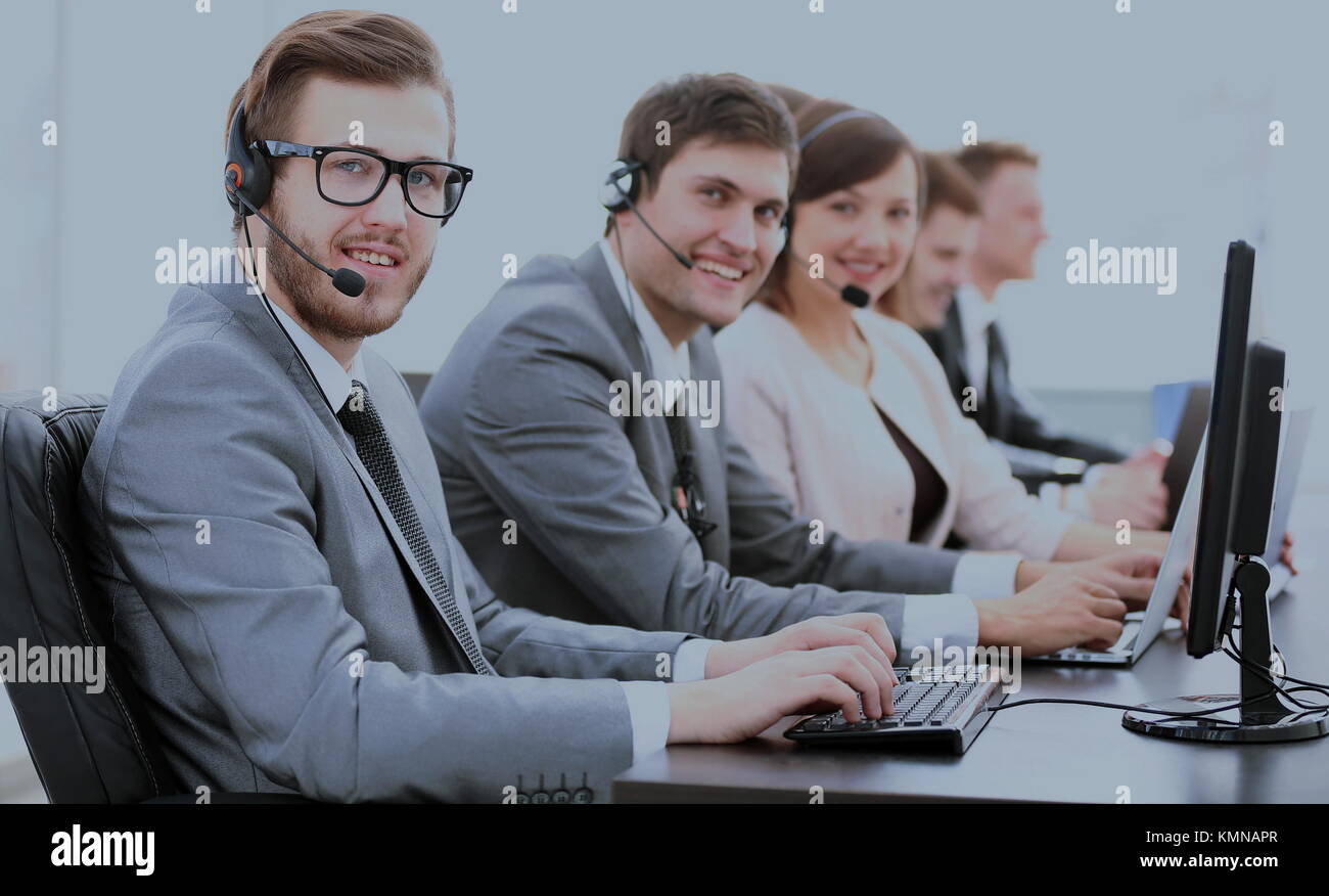 experienced assistants with a headset in front of computers in t Stock ...
