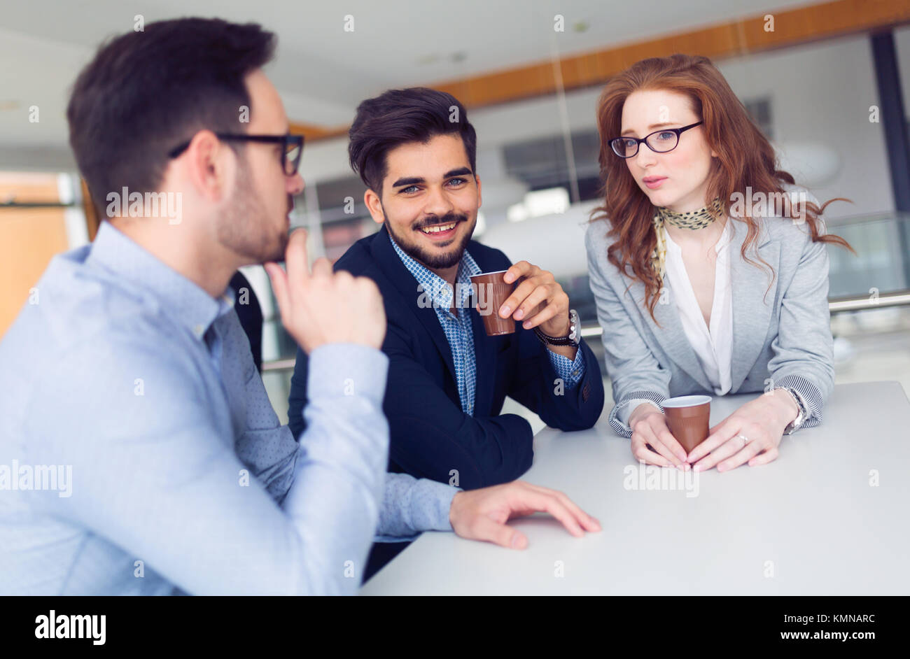 Business colleagues having conversation during coffee break Stock Photo ...