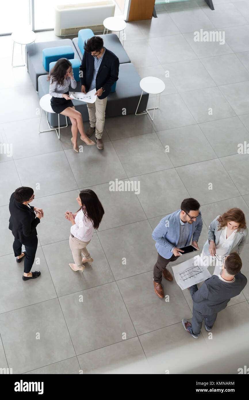 Group of business people collaborating and working on project Stock ...