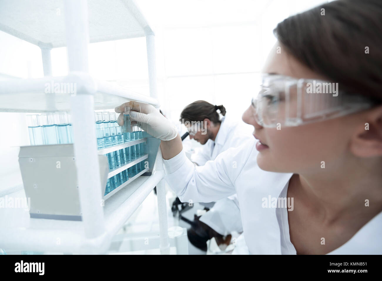 Young woman with test tubes in the laboratory Stock Photo - Alamy