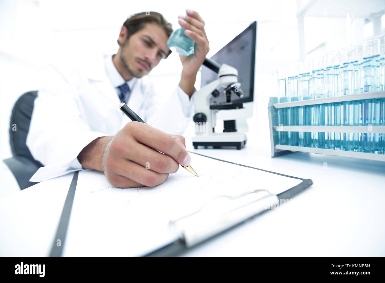 scientist analyzing an experiment in a laboratory Stock Photo - Alamy