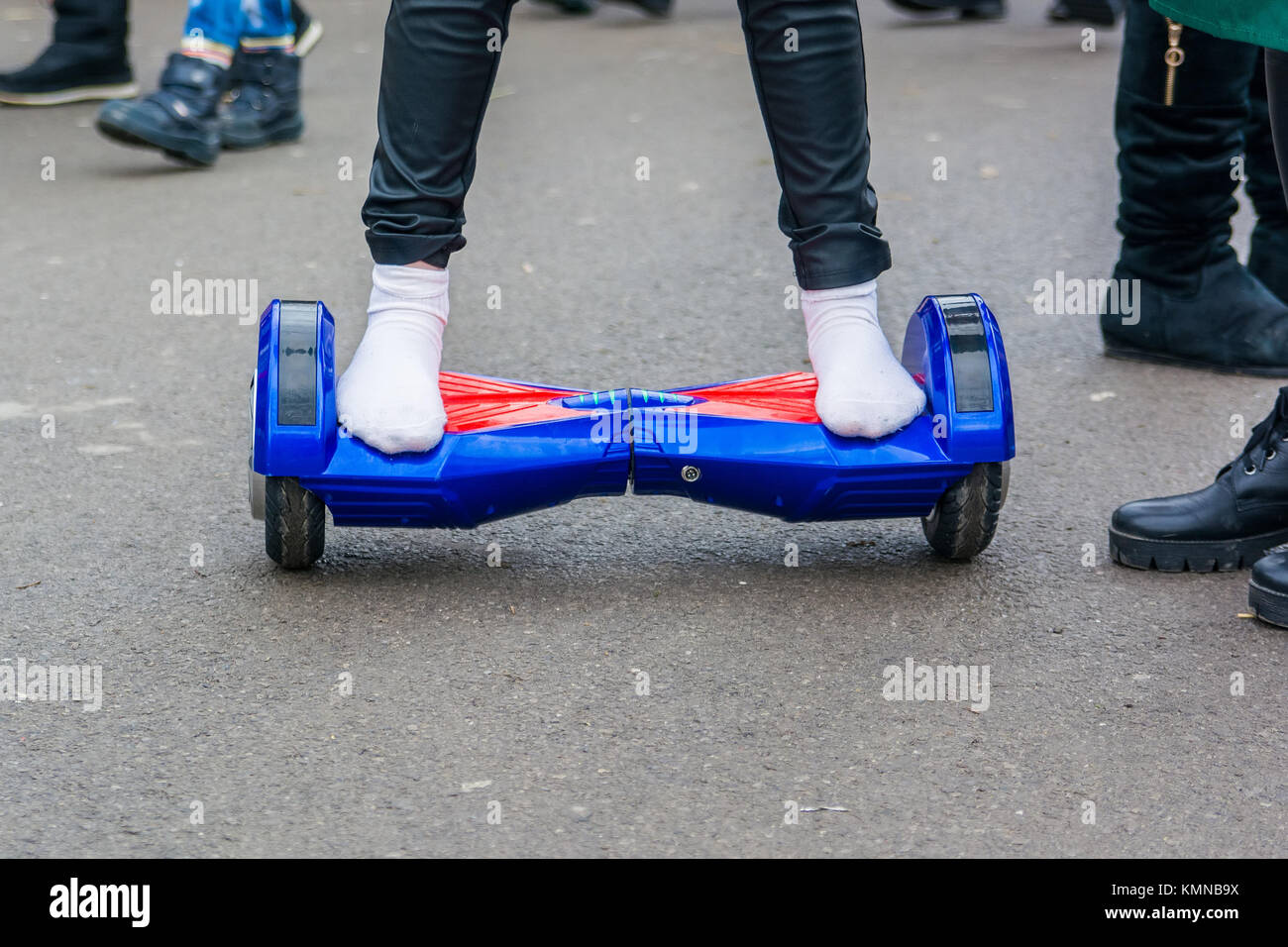 Close up feet in socks on hoverboard Stock Photo - Alamy