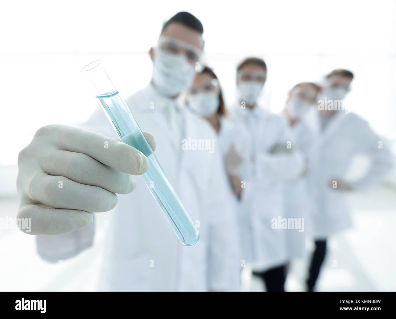 background image is a group of medical workers working with liquids in ...