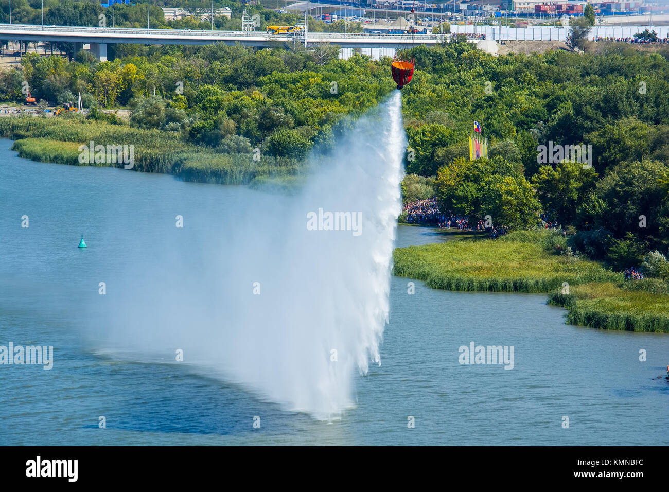 Water drop in river from helicopter bucket Stock Photo - Alamy