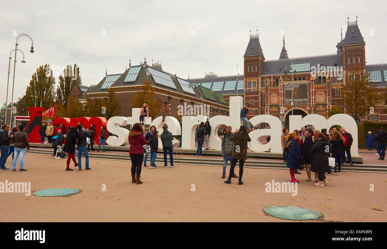 Tourists and the I Amsterdam giant letters marketing slogan with ...