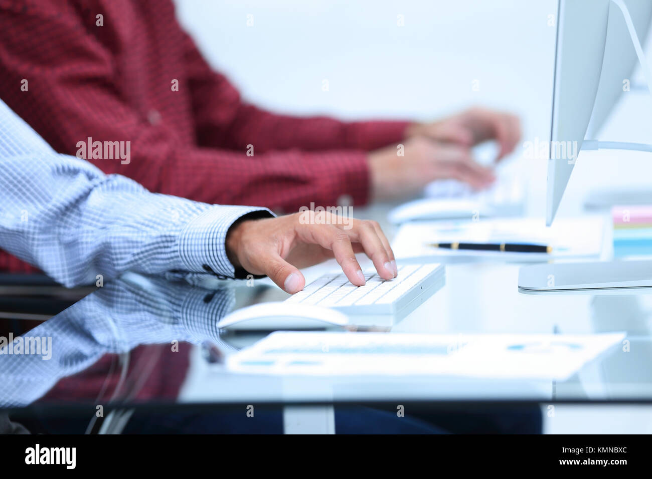 closeup of employees typing on the keyboard Stock Photo - Alamy