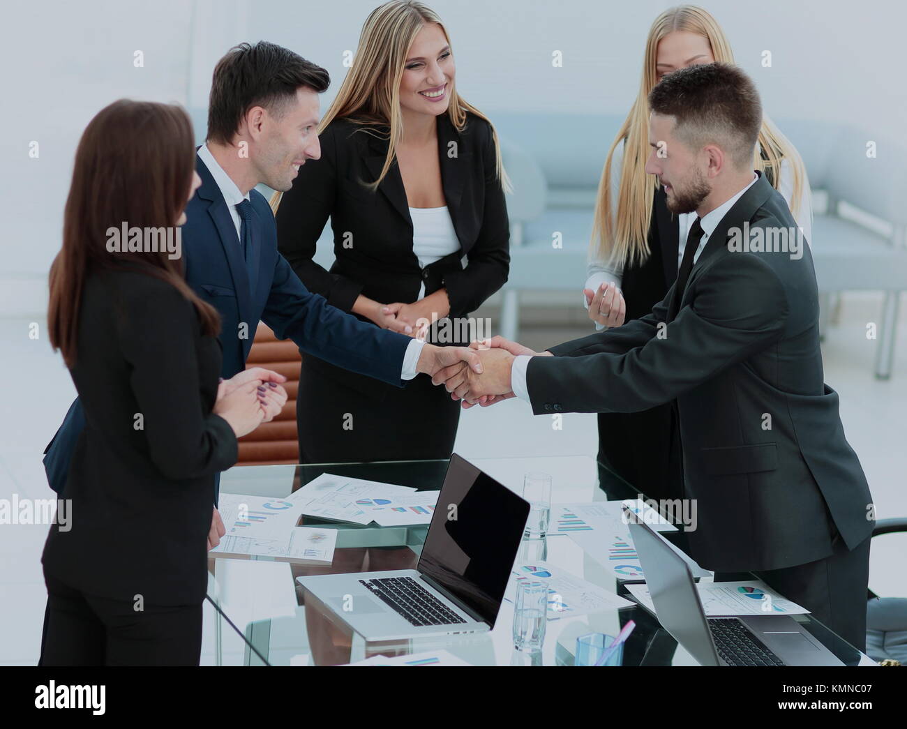 Business partner greeting each other with handshake Stock Photo - Alamy