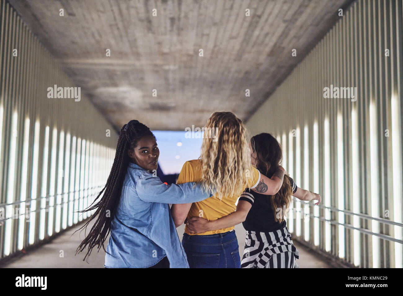 Girlfriends arm in arm hi-res stock photography and images - Alamy