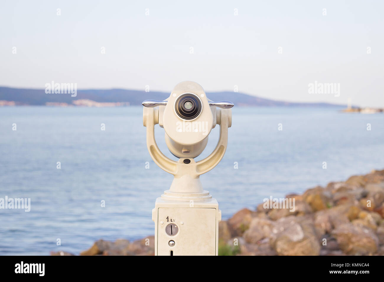 Telescope on the sea-summer, sun, sea beach Stock Photo - Alamy