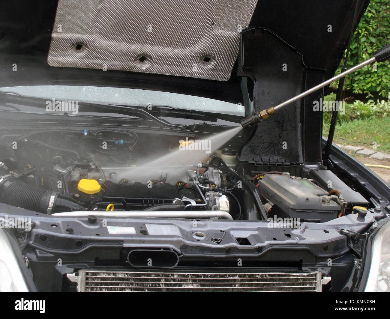 Car engine cleaning with high pressure water jet Stock Photo - Alamy
