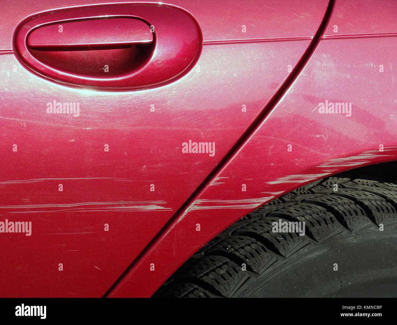 Scratches and abrasions on red color car body paint Stock Photo - Alamy