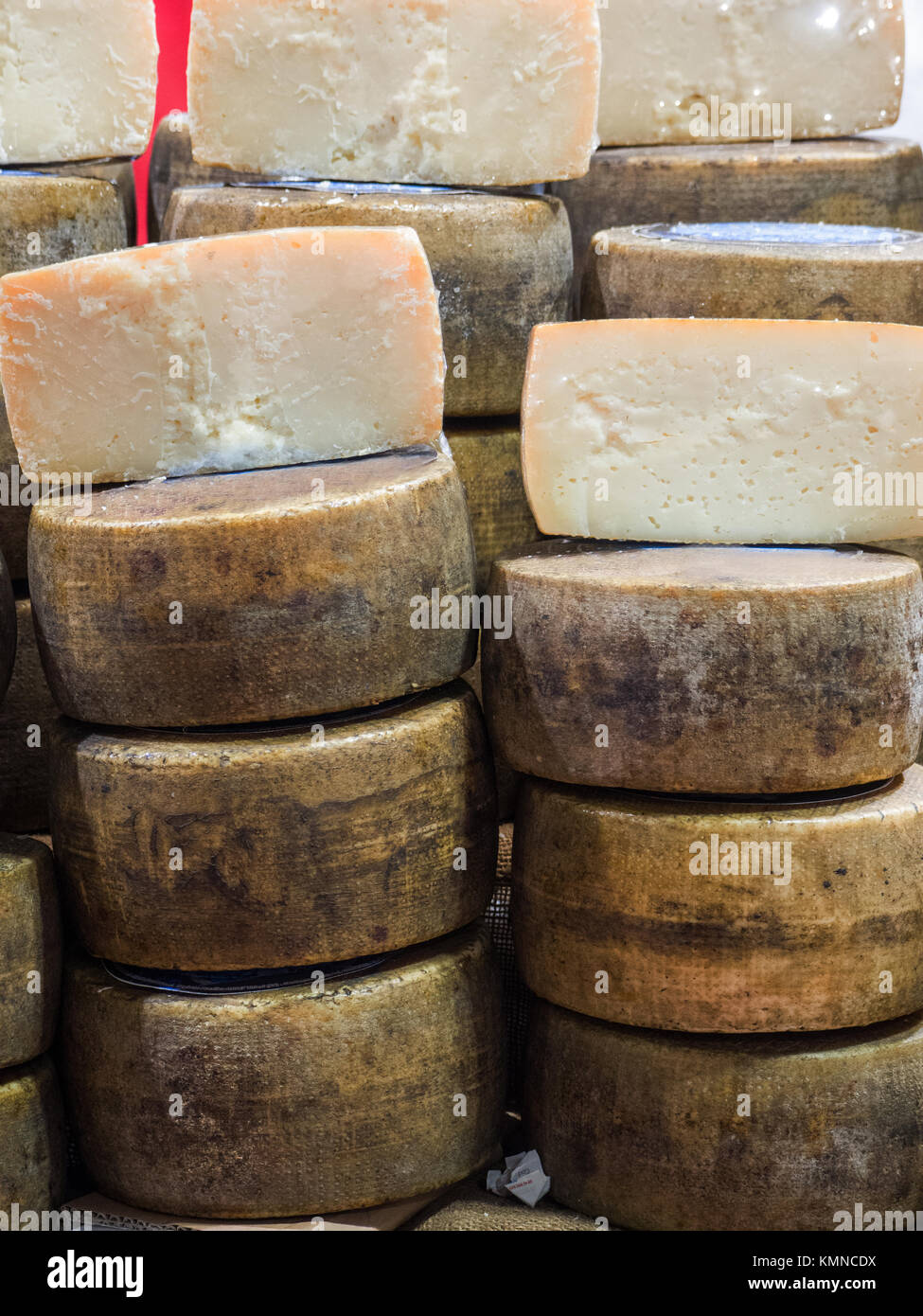 Italian artisan cheese forms, stacked in a warehouse Stock Photo - Alamy