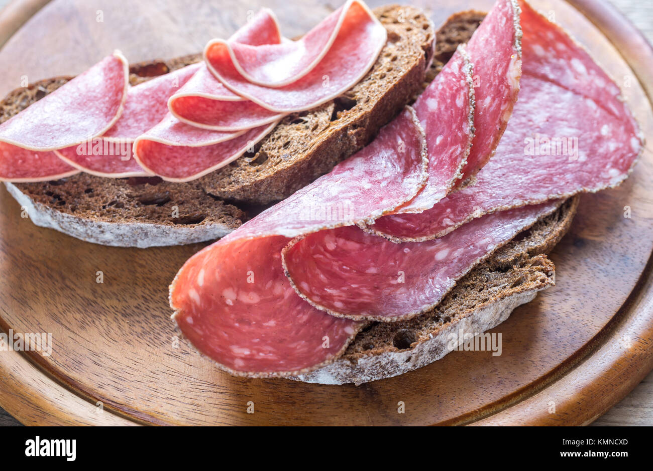 Sandwiches with dark-rye bread and different kinds of salami Stock ...
