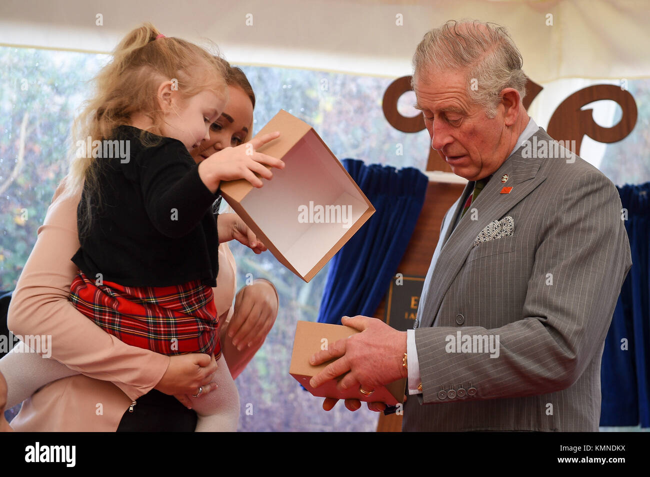 Three-year-old Lexi-Mai, presents the Prince of Wales a box of handmade ...