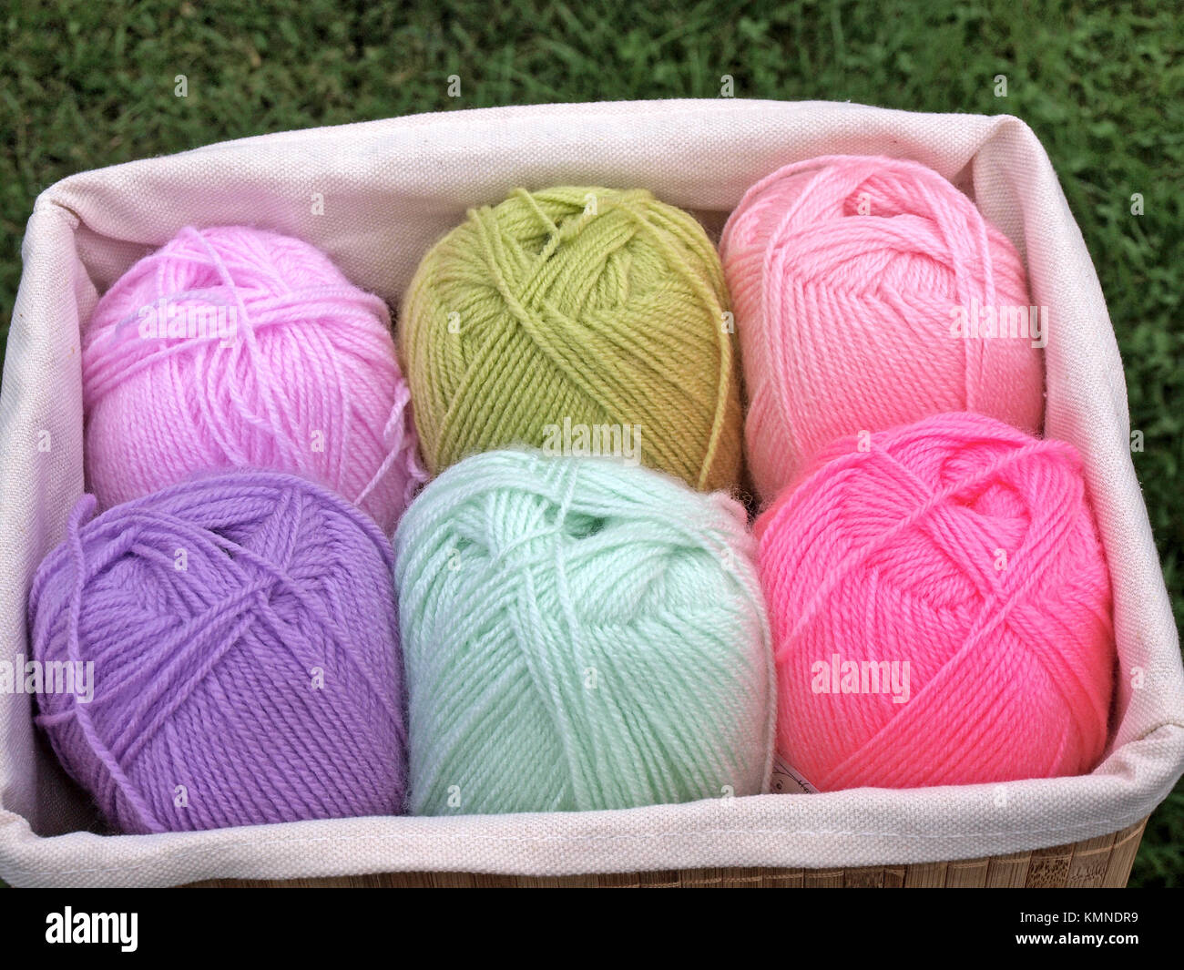 Set of colorful soft woolen yarn balls outdoor in bamboo box Stock ...