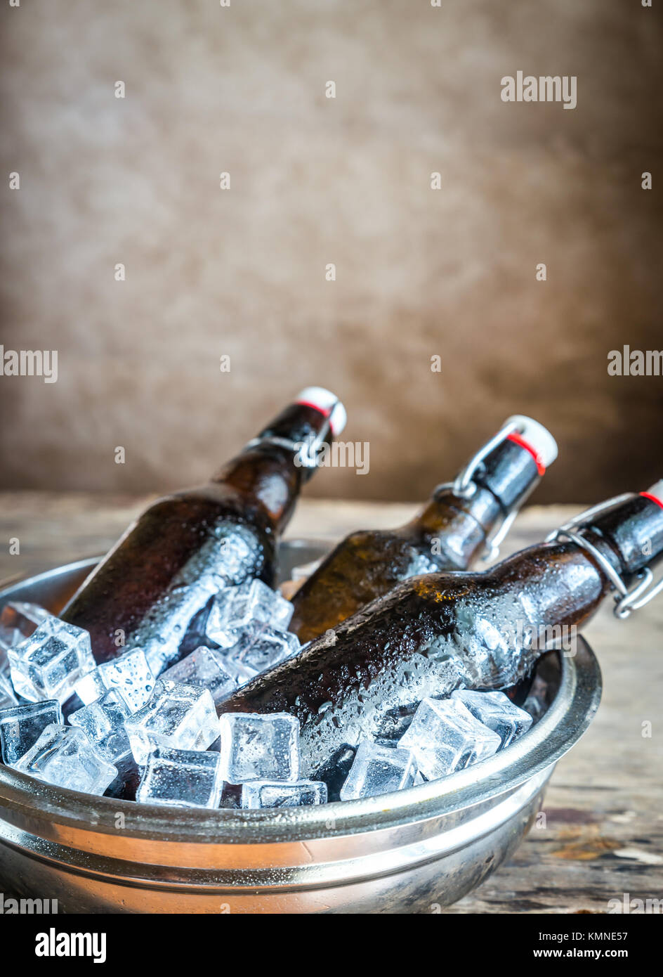 Bottles of beer in ice cubes Stock Photo - Alamy