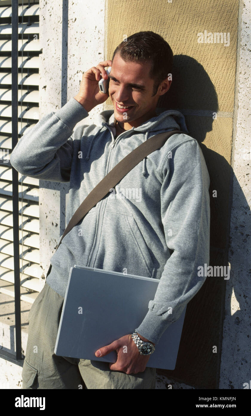 Young man on phone Stock Photo - Alamy