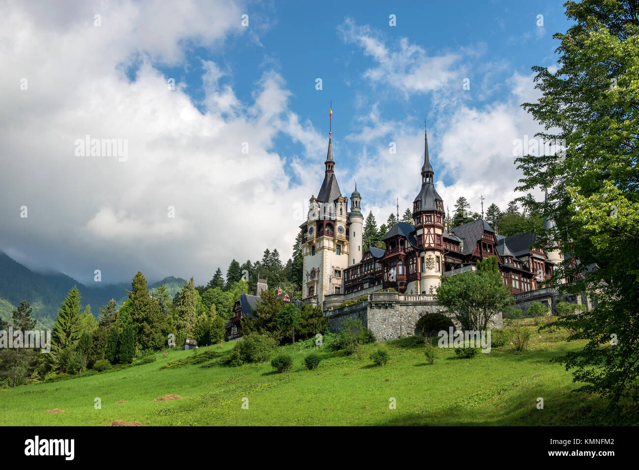 pelesh castle with fog in the mountains Stock Photo - Alamy