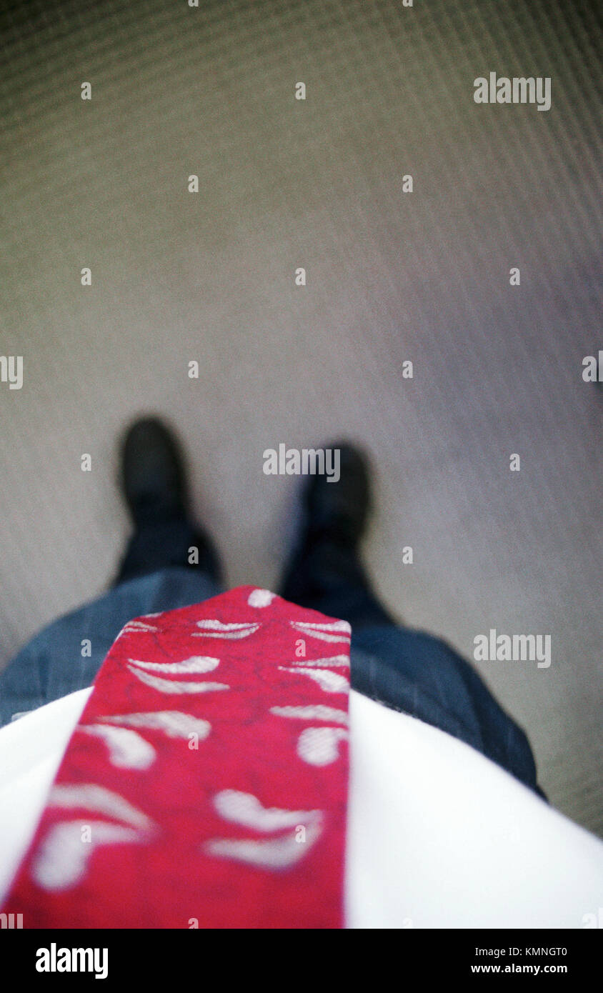 Businessman looking downward Stock Photo - Alamy