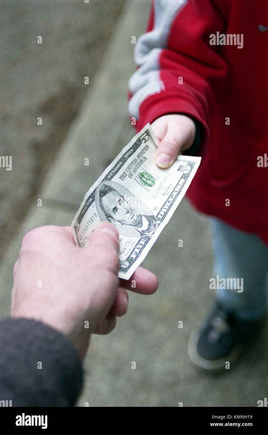 Old hand giving money kid hi-res stock photography and images - Alamy