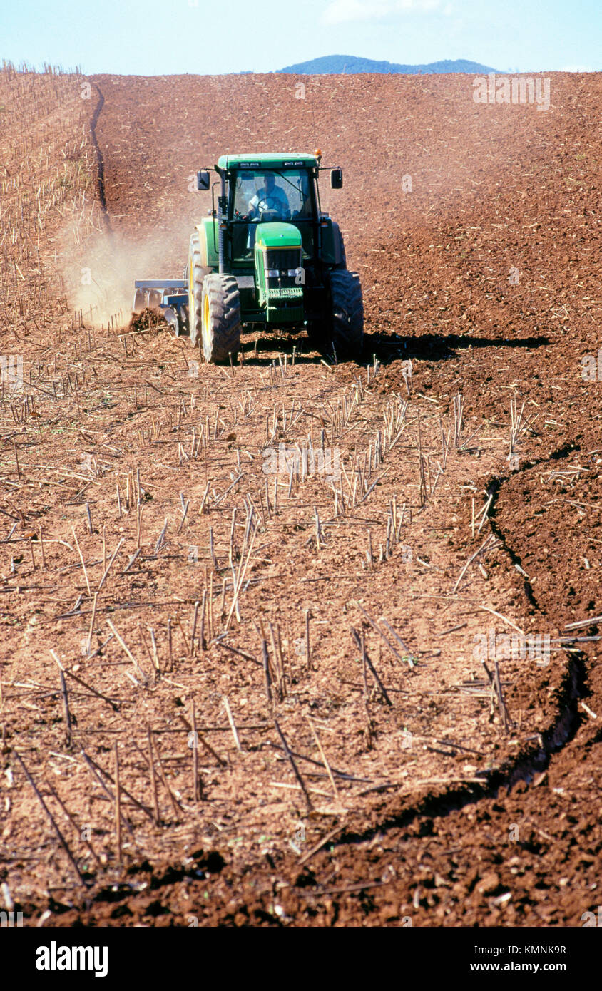 Tractor dragging a plough Stock Photo - Alamy
