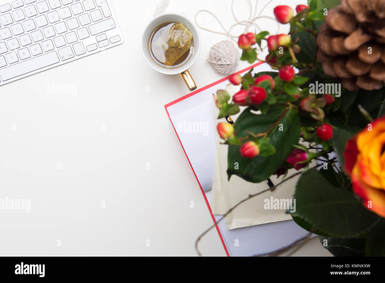 Creative workspace in home office with pen, paper and keyboard ...