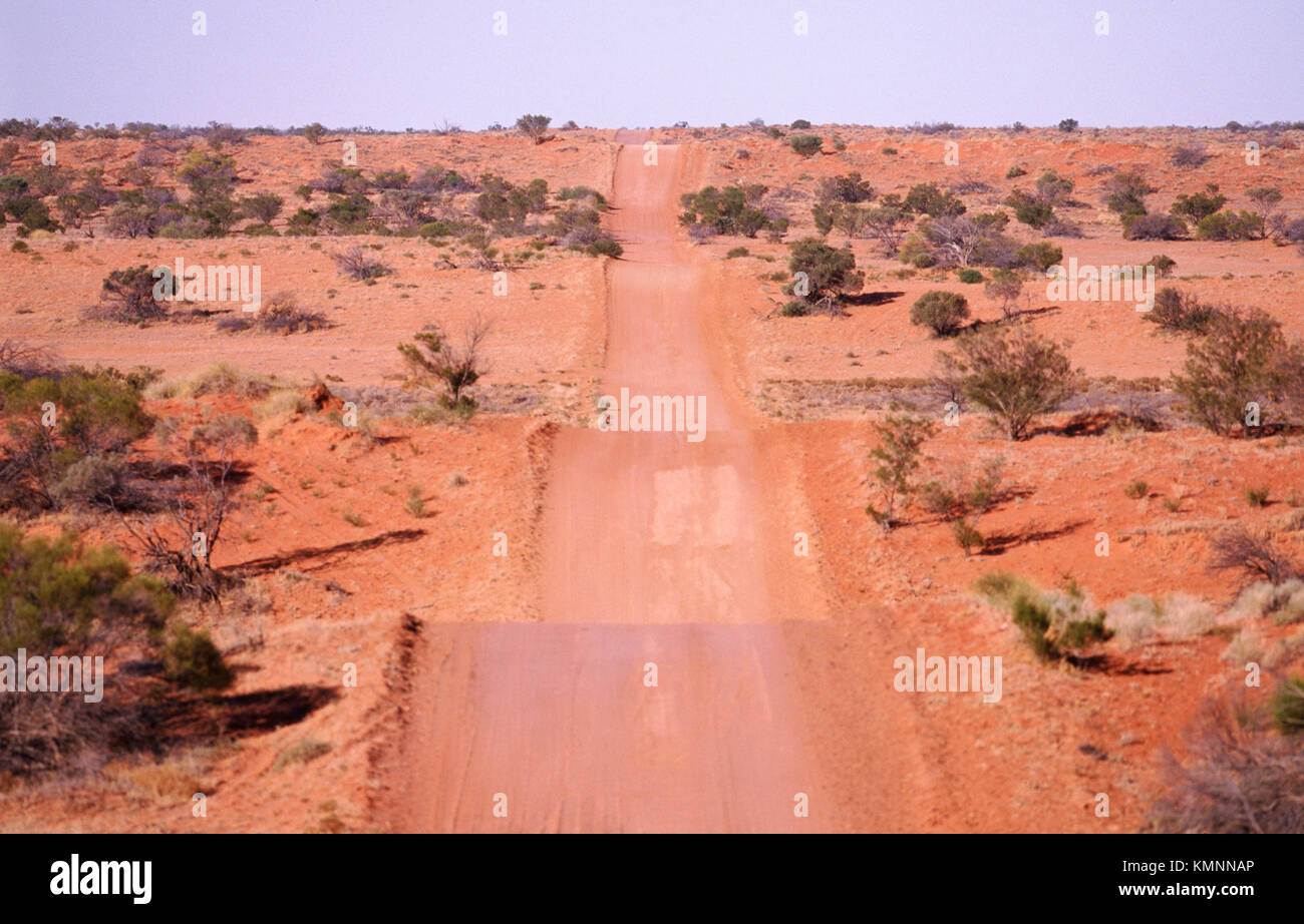 Undulating dirt road across sand dunes. Outback. Australia Stock Photo ...