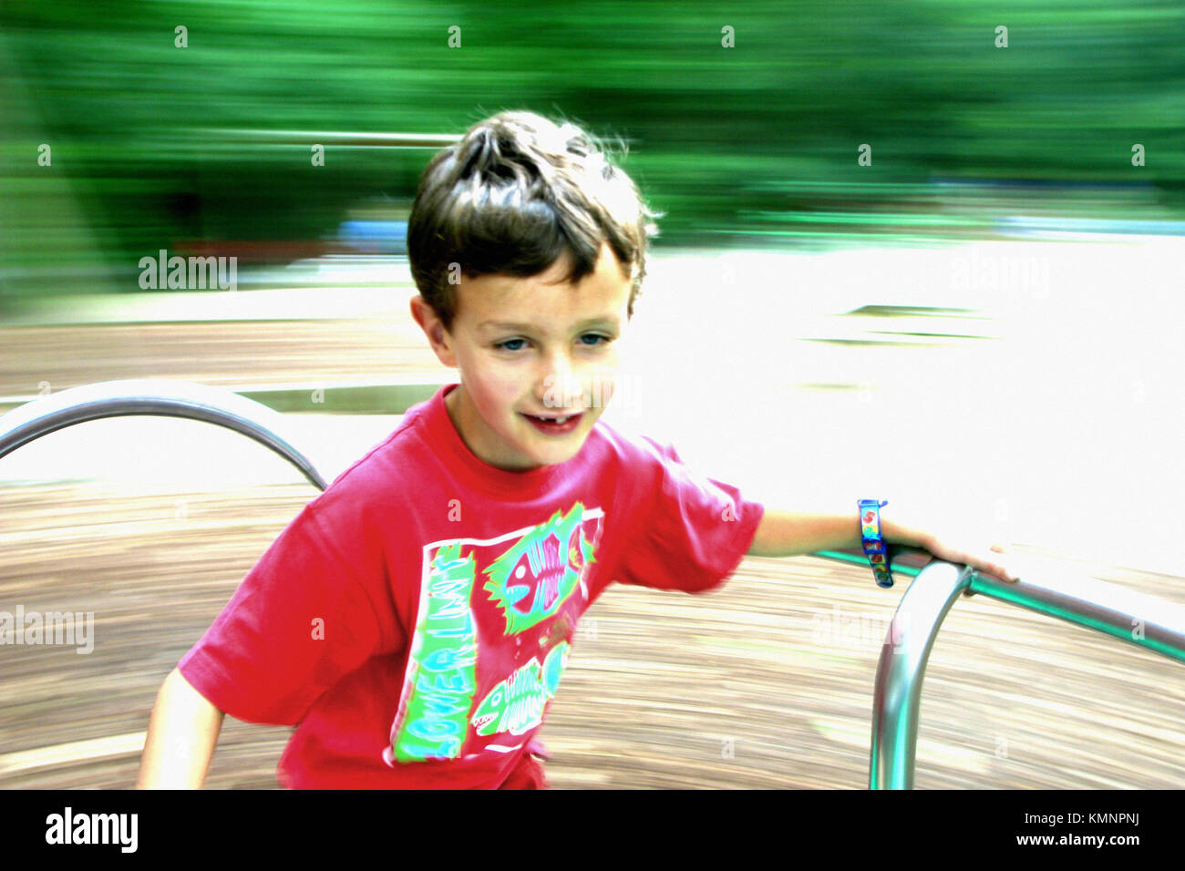 One child spinning playground hi-res stock photography and images - Alamy
