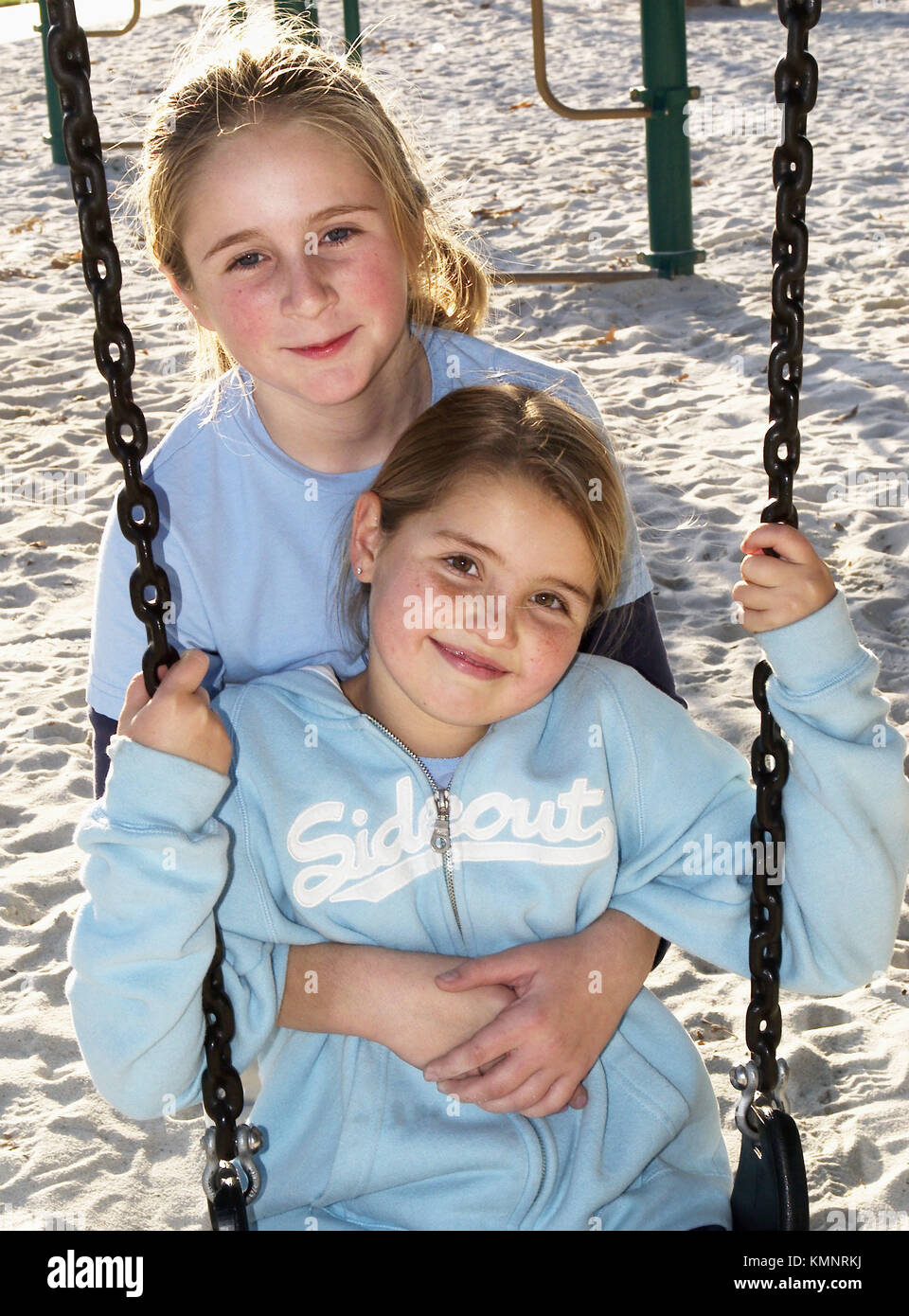 sisters on swing Stock Photo - Alamy
