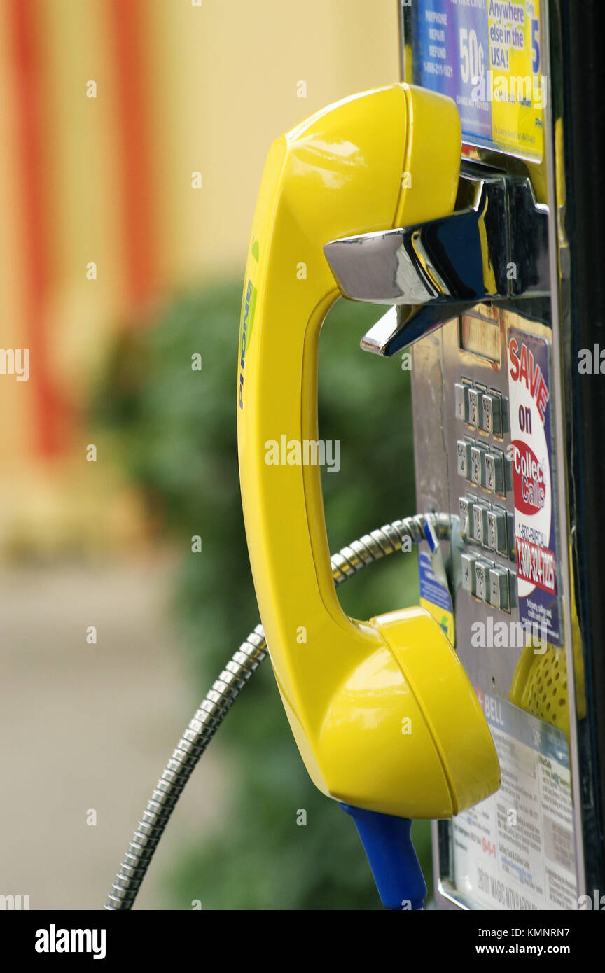 yellow pay phone Stock Photo - Alamy
