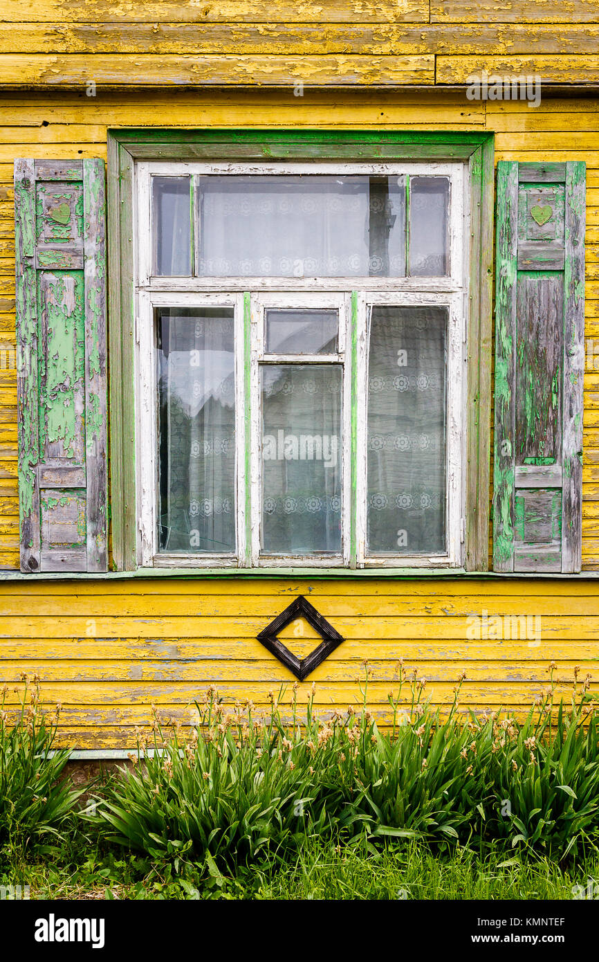 Old window on a aged wooden wall. Architectural detail. Architecture ...