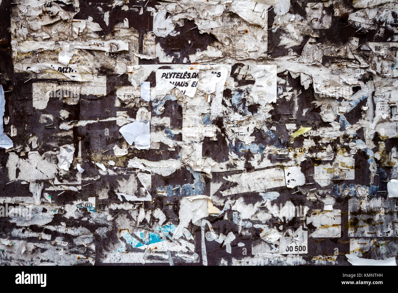 Scraps of paper on old bulletin board Stock Photo - Alamy
