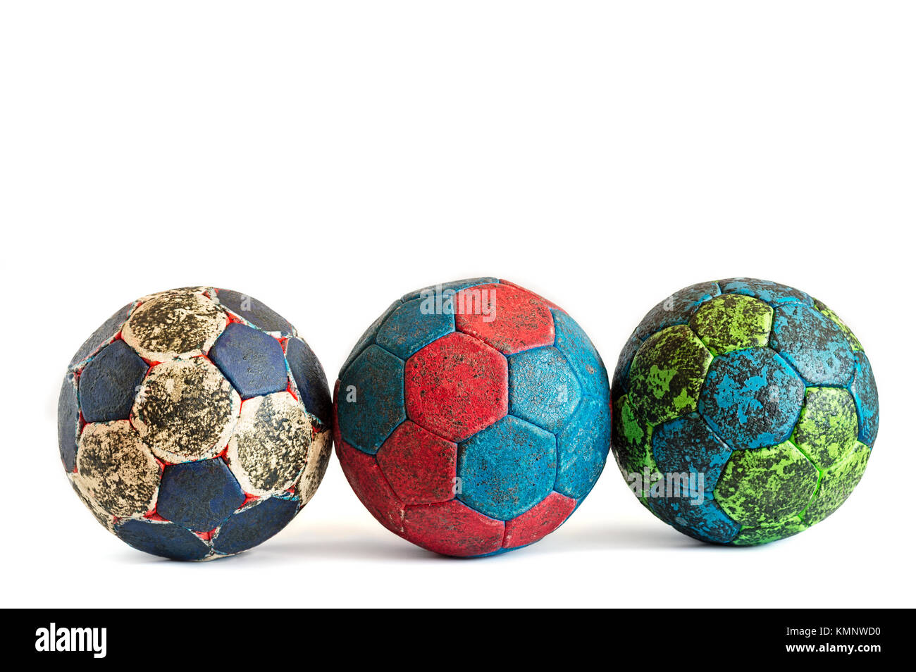Row of three dirty handball balls isolated on white Stock Photo - Alamy