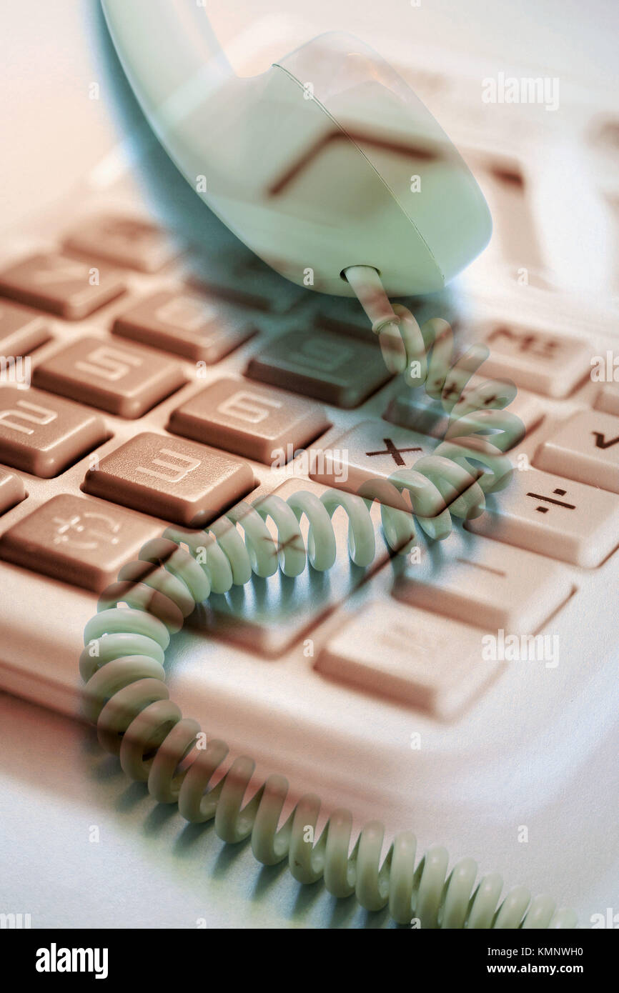 Calculator and telephone Stock Photo - Alamy