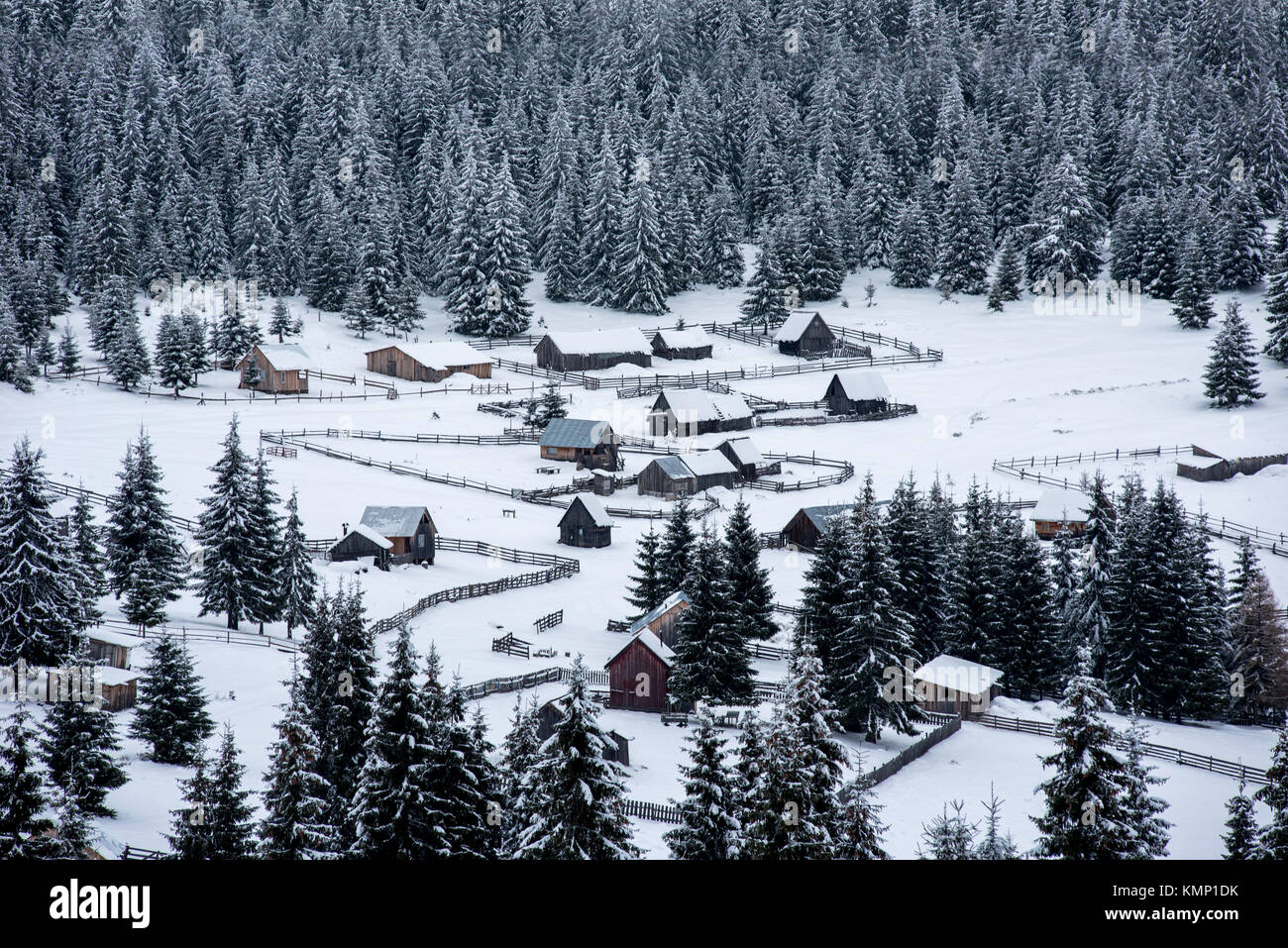Small winter village in the mountains covered by snow Stock Photo - Alamy