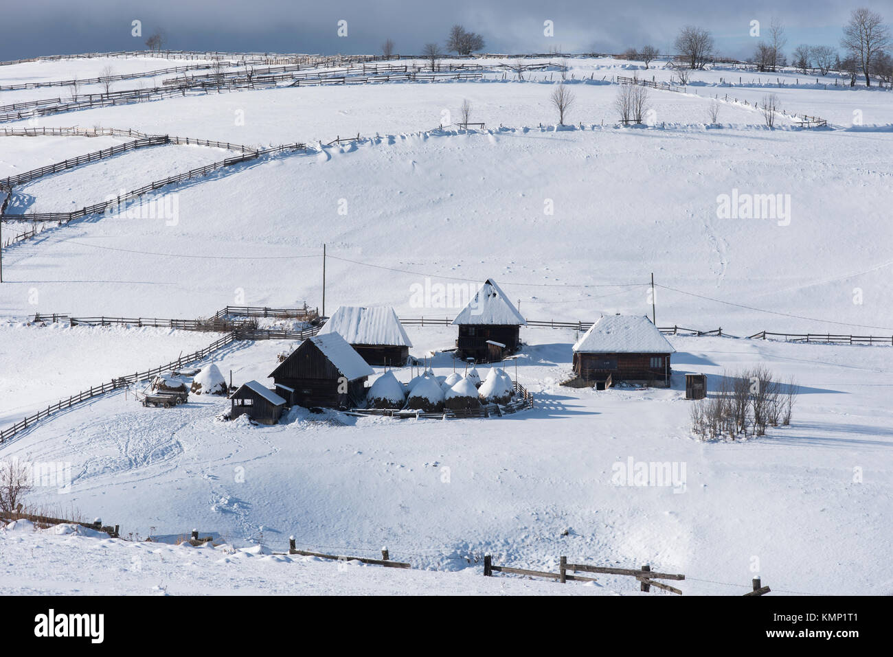 Small winter village in the mountains covered by snow Stock Photo - Alamy
