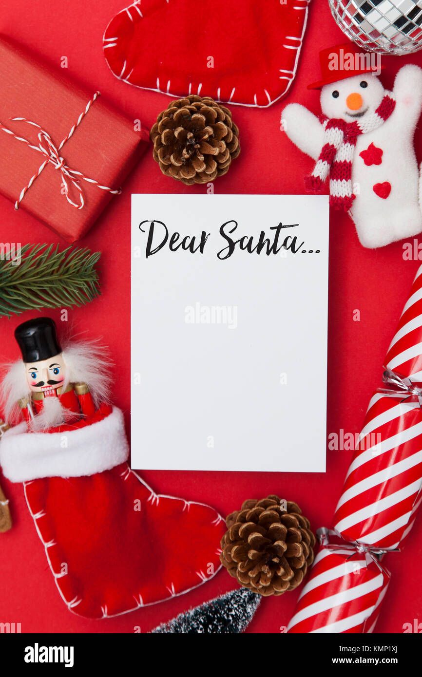Festive message on white paper with a collection of Christmas ...