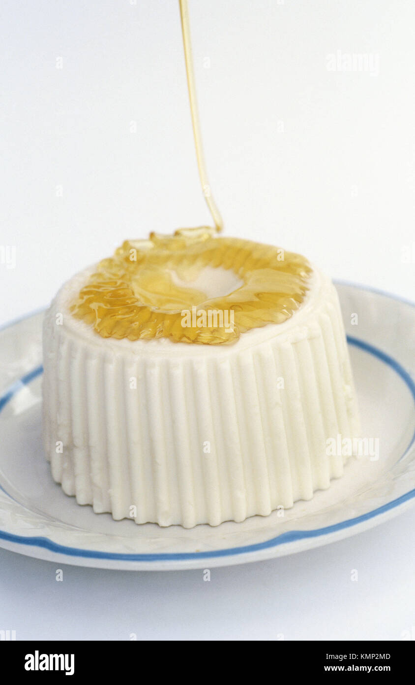 Fresh cheese with honey Stock Photo - Alamy