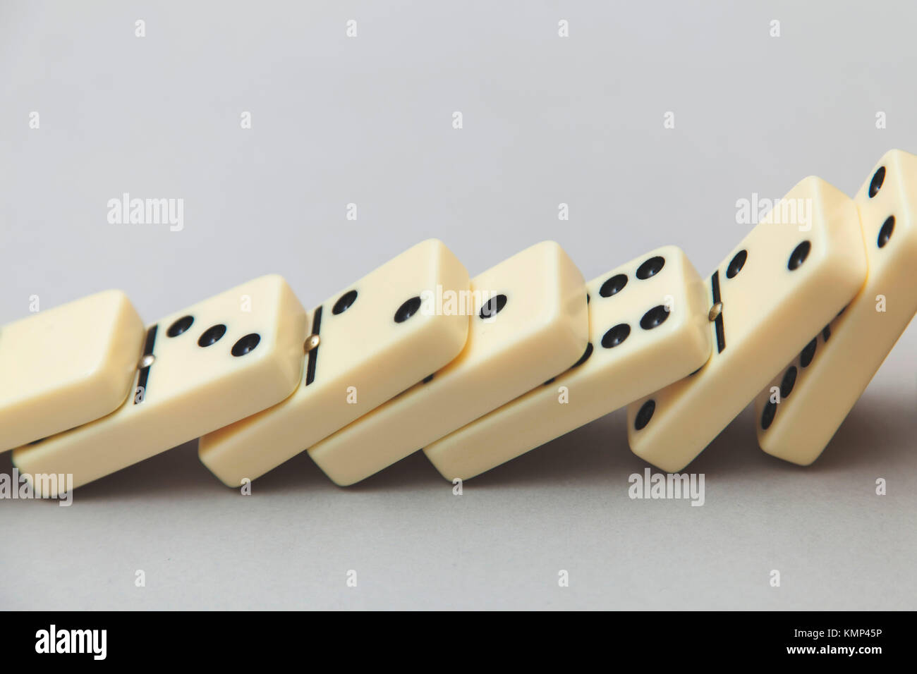 Domino background. Business strategy concept Stock Photo - Alamy