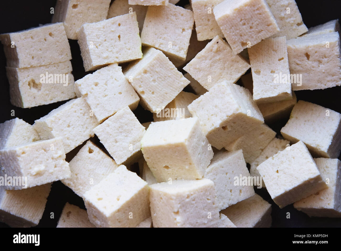 Pieces of Tofu cut into cubes Stock Photo - Alamy