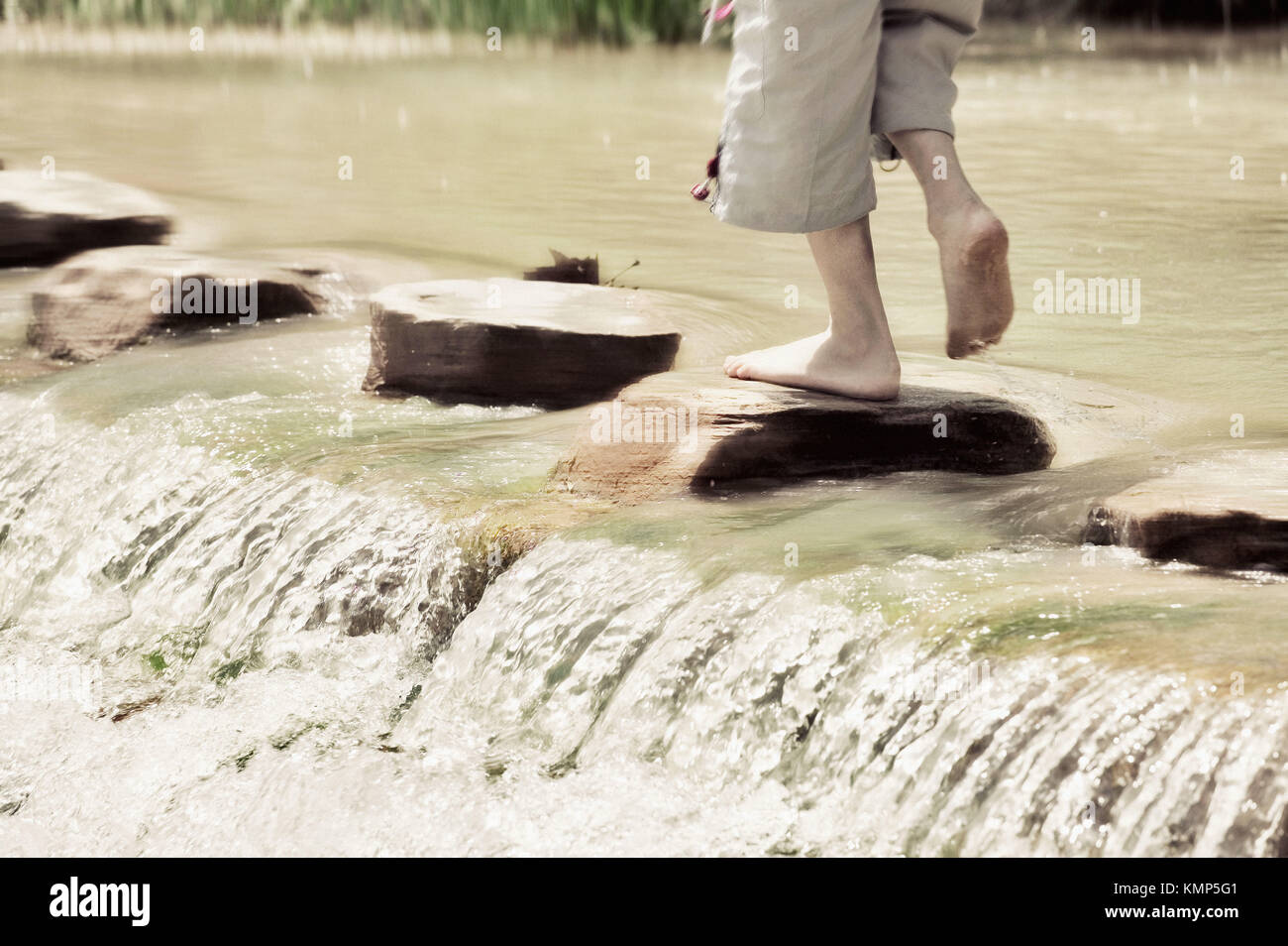 Child stepping stone hi-res stock photography and images - Alamy