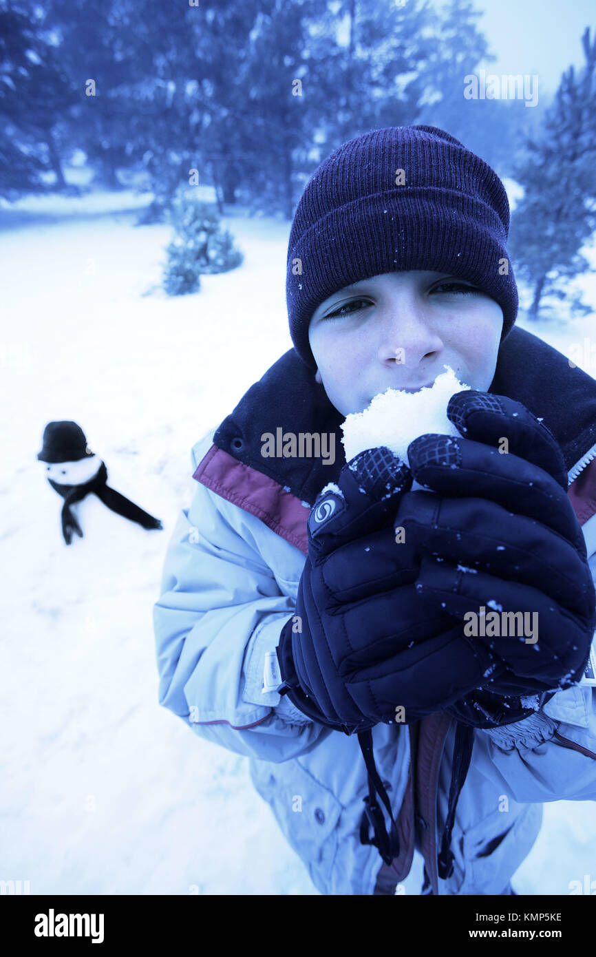 Child tasting the snow hi-res stock photography and images - Alamy