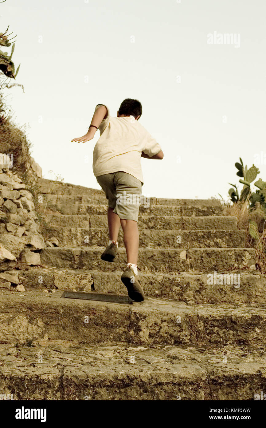 Children running up the stairs hi-res stock photography and images - Alamy