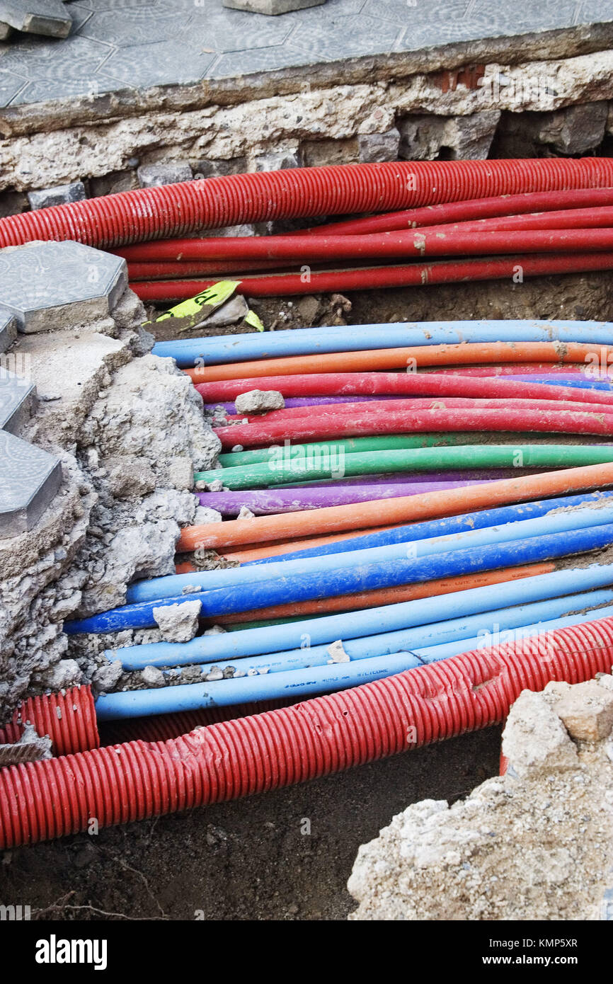 Electric cables under city pavement Stock Photo - Alamy