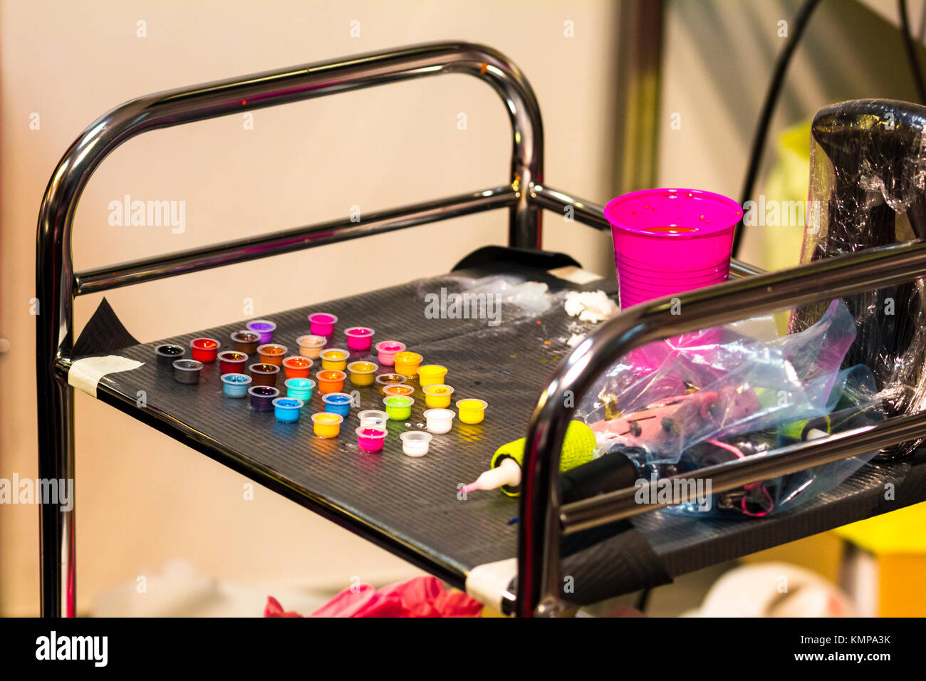 Colors and tools used for tattooing, ink and needles sterilized ...